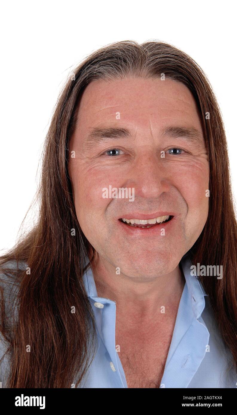 A handsome indigenous man smiling in a portrait shoot with his long ...