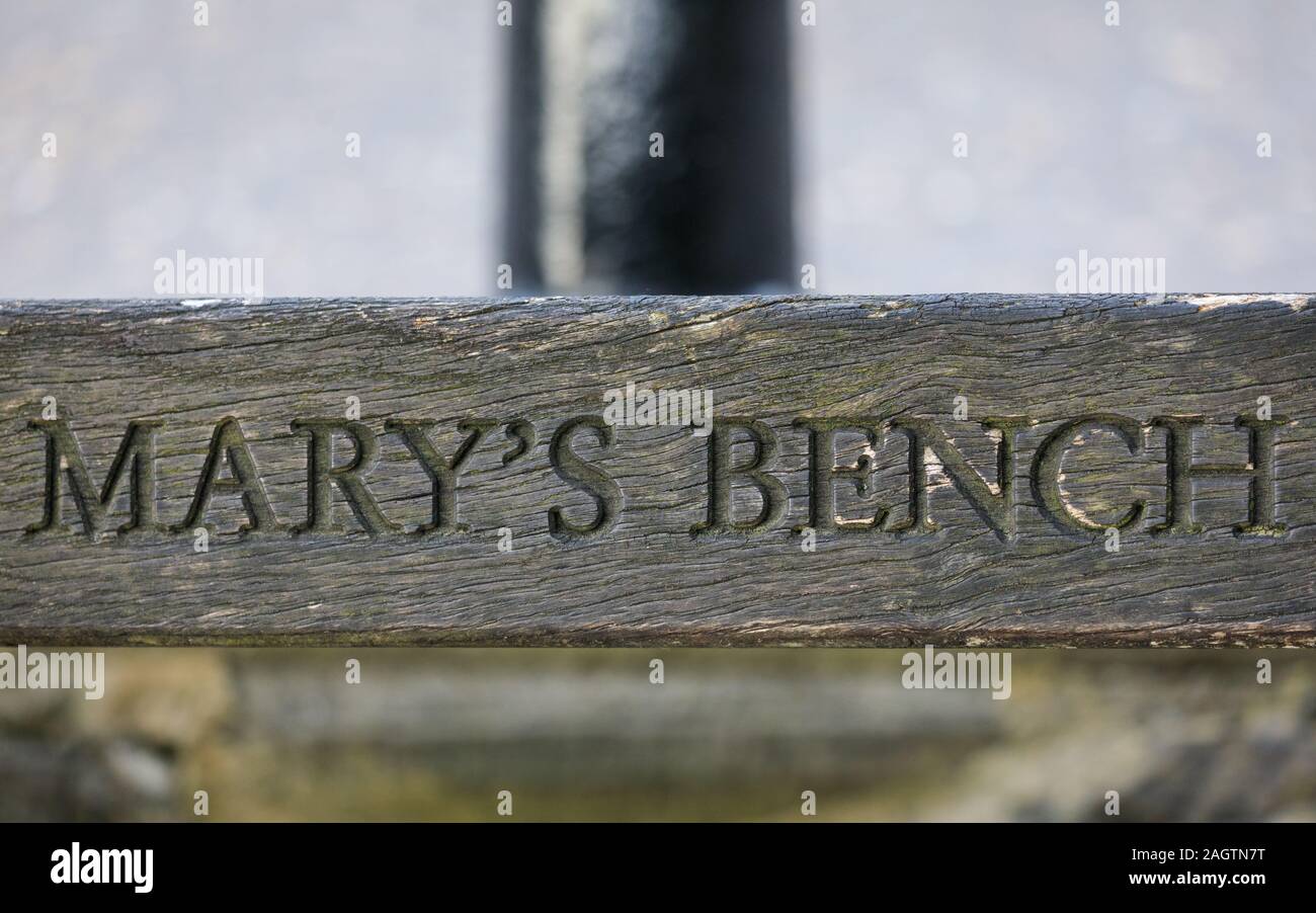 Detail, top of a park bench inscribed 'Mary's Bench' in memory of a ...