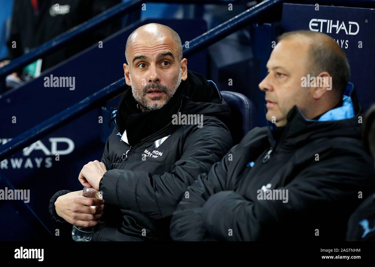 Manchester City manager Pep Guardiola (left) with assistant Rodolfo ...