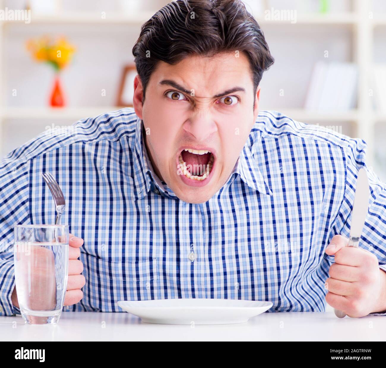 The man on diet waiting for food in restaurant Stock Photo - Alamy
