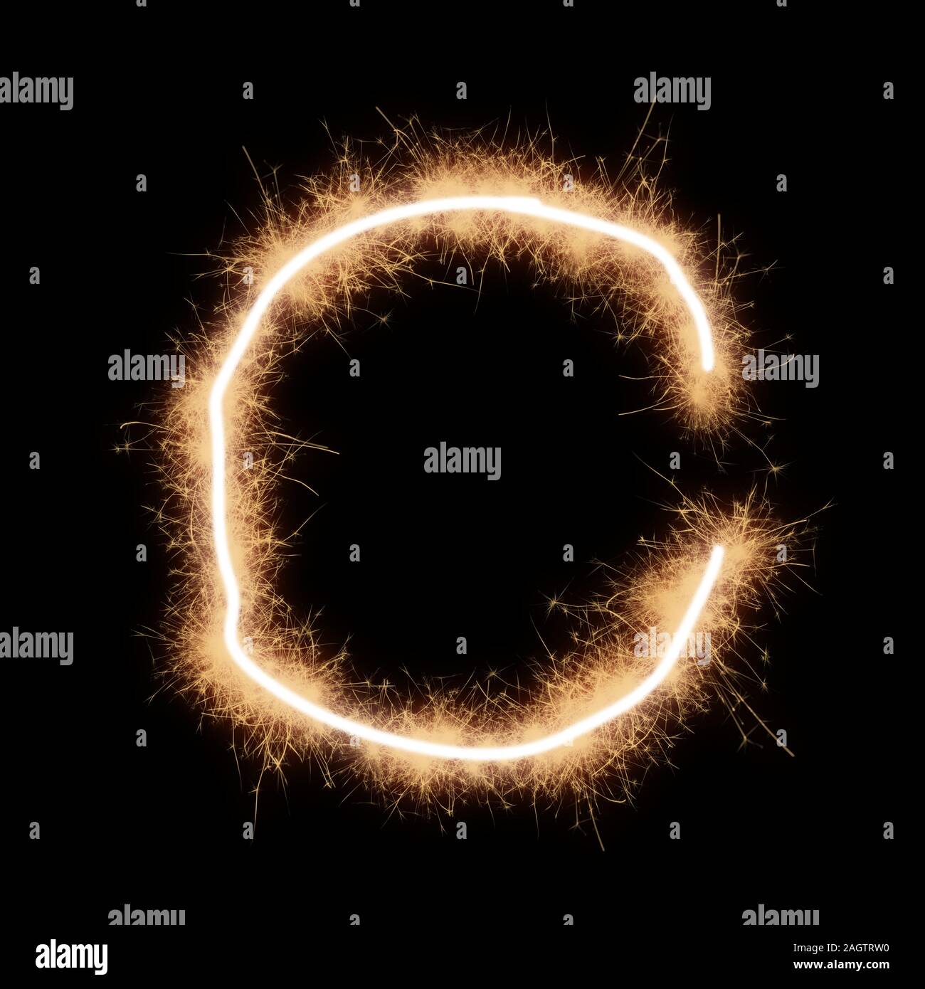 Lower case c letter of alphabet written by squib sparks on a black ...