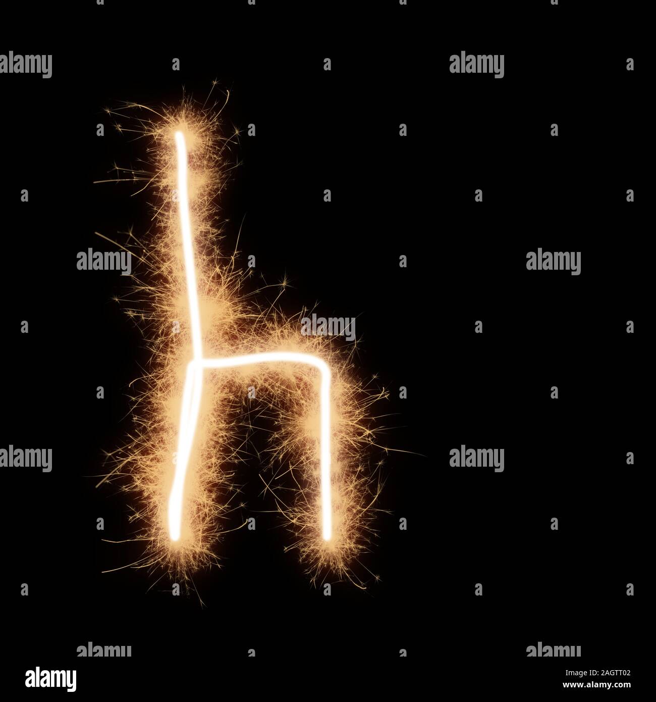 Lower case h letter of alphabet written by squib sparks on a black ...
