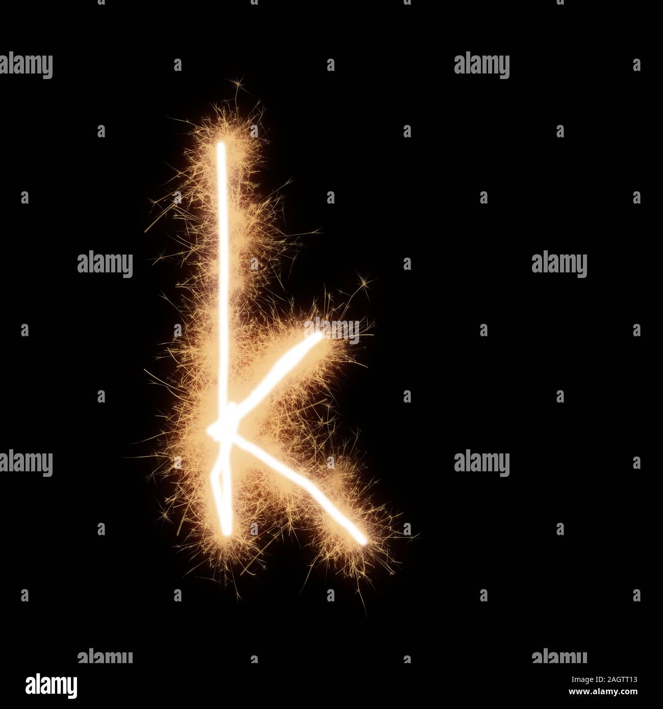 Lower case k letter of alphabet written by squib sparks on a black ...