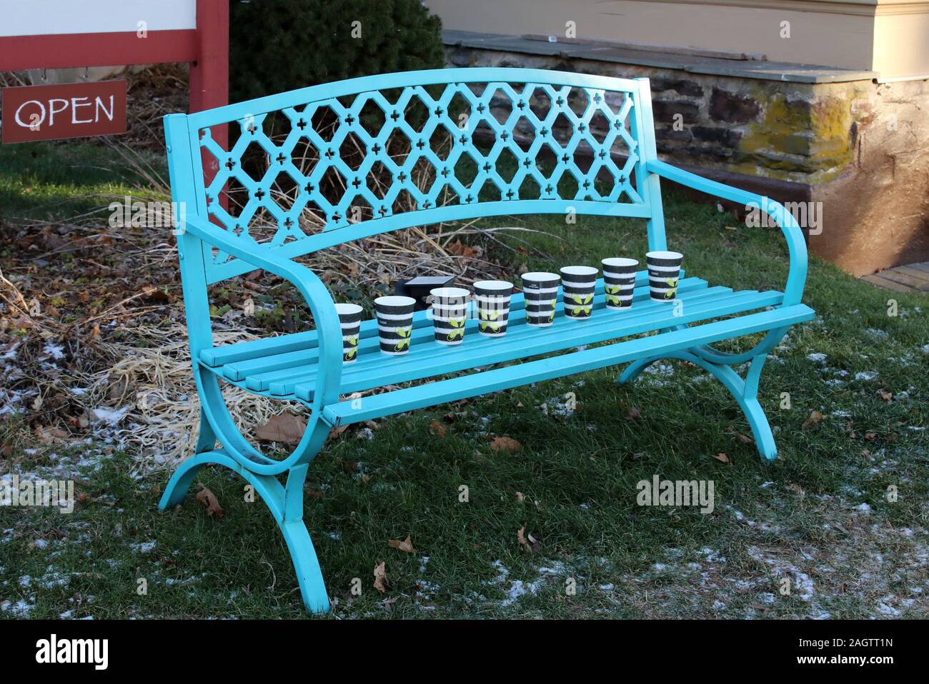 The blue bench is in front of the restaurant Stock Photo - Alamy