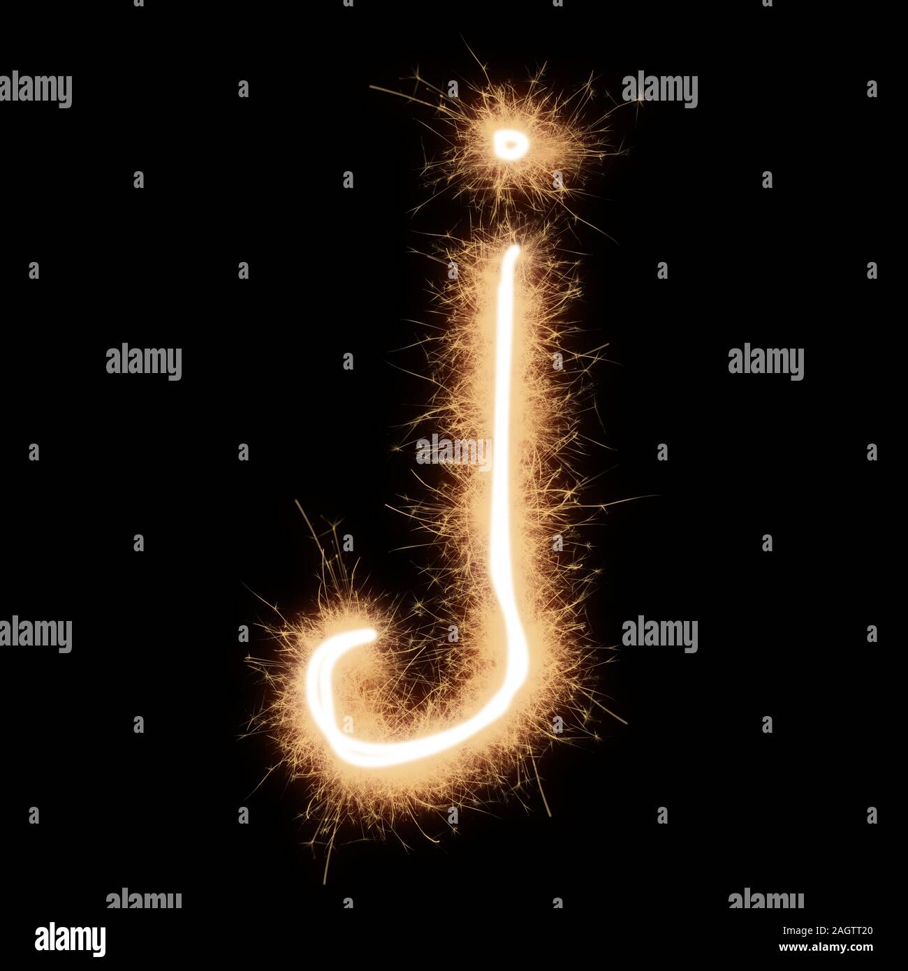 Lower case j letter of alphabet written by squib sparks on a black ...