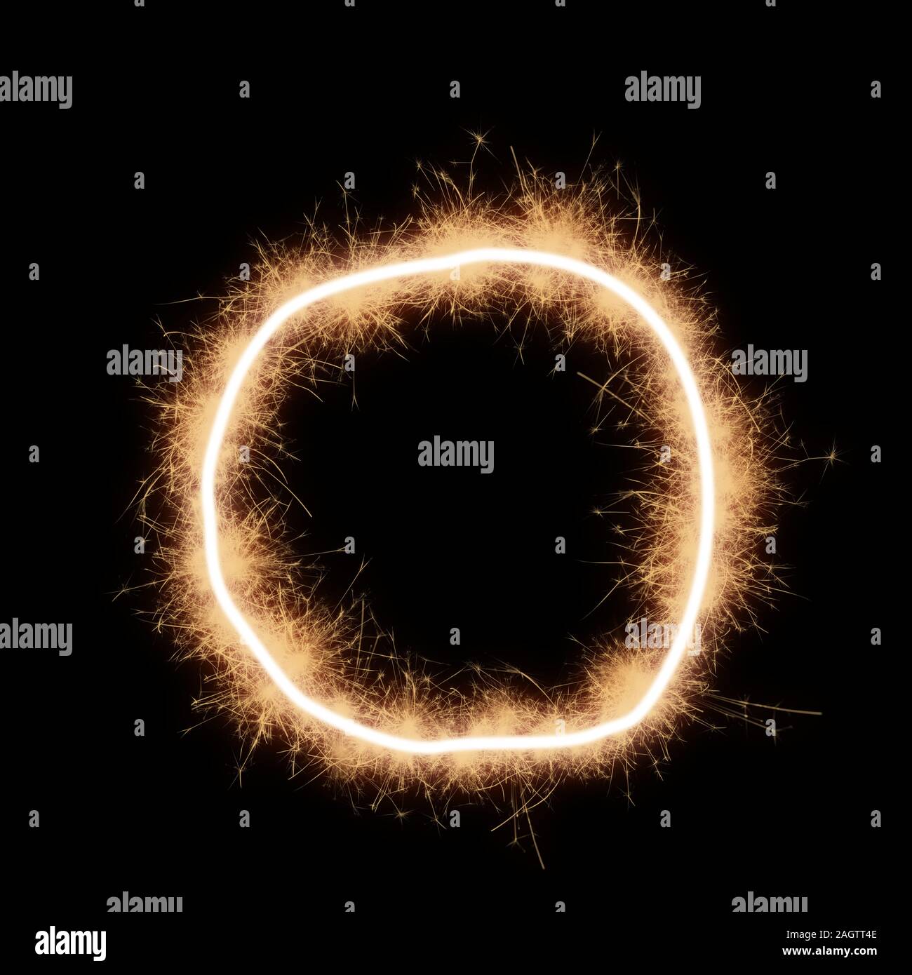 Lower case o letter of alphabet written by squib sparks on a black ...