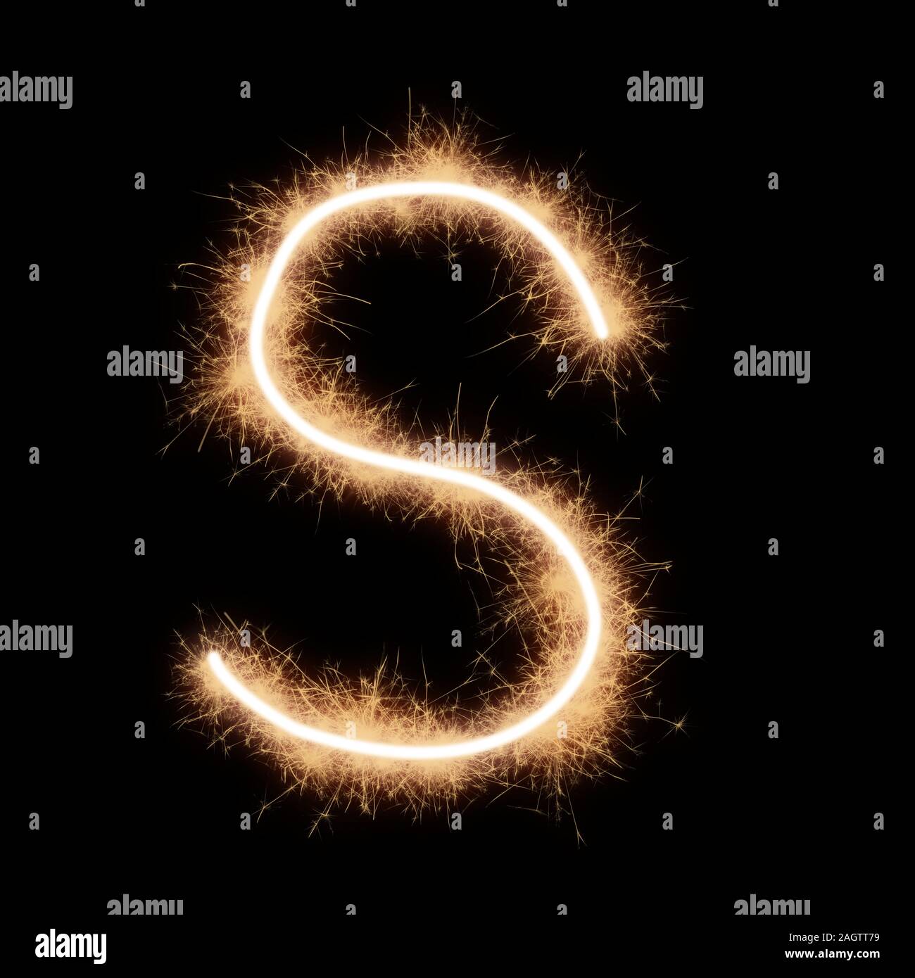 Lower case s letter of alphabet written by squib sparks on a black ...
