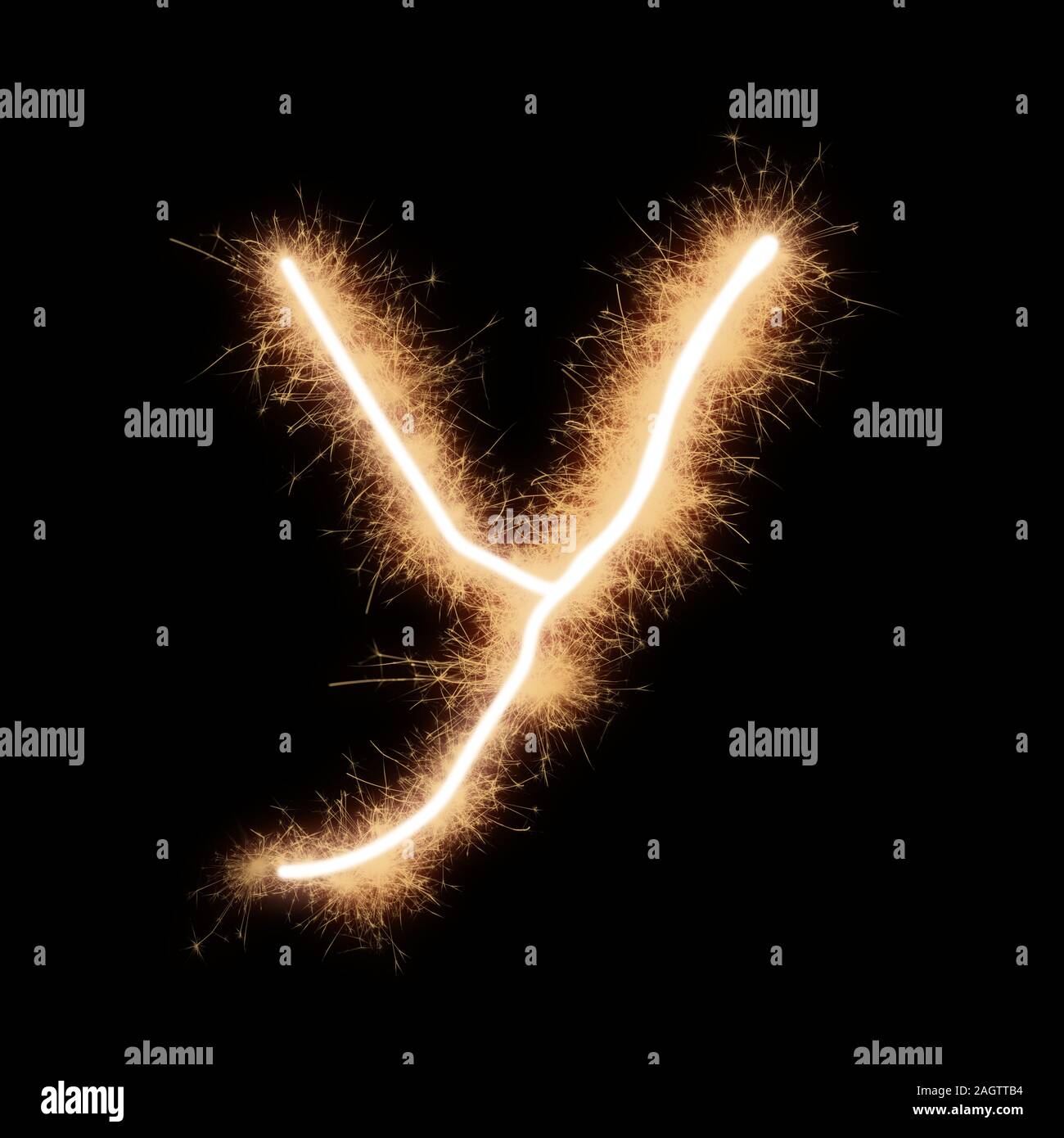 Lower case y letter of alphabet written by squib sparks on a black ...