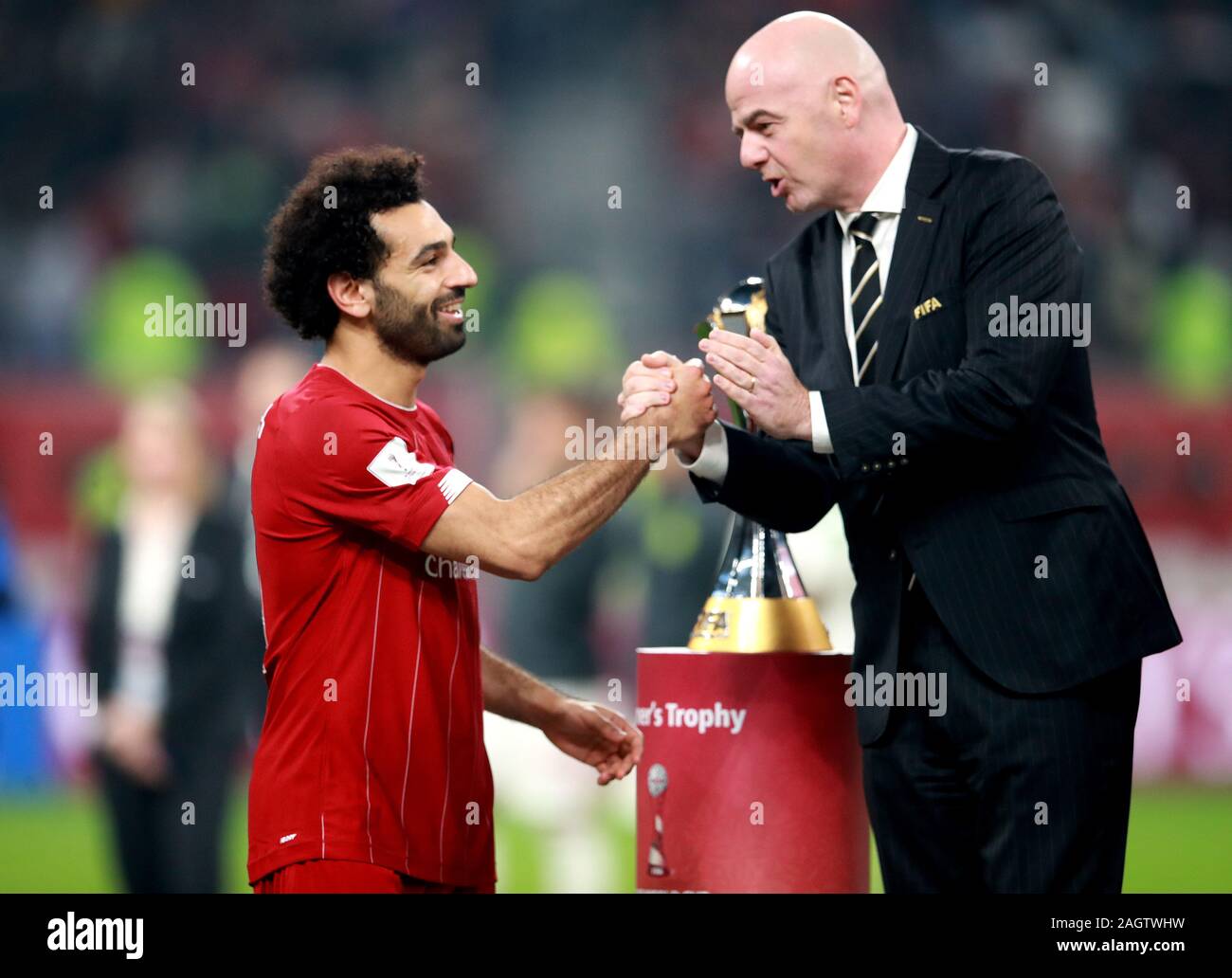 Liverpool's Mohamed Salah shakes hands with FIFA President Gianni ...