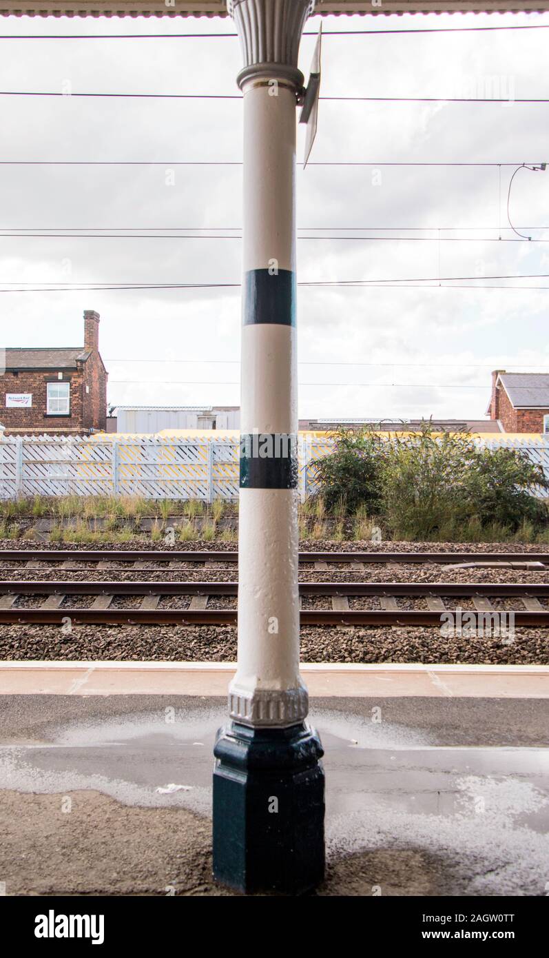 A view on a typical British train station platform during the daytime ...