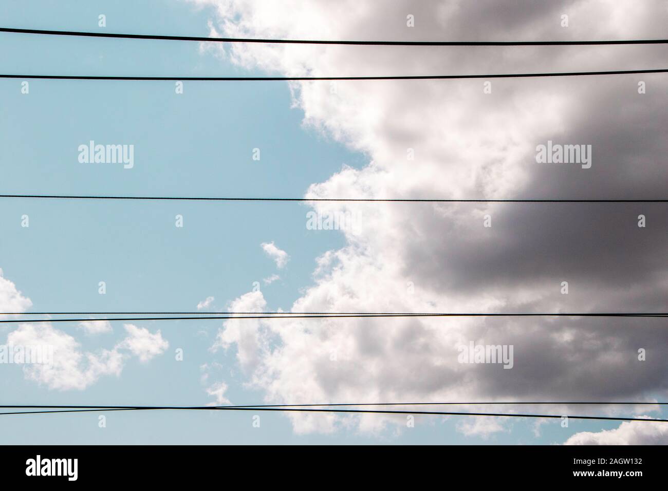 Power lines above a railway track that supply energy to the trains that ...