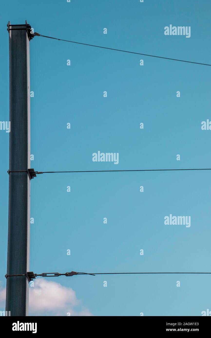 Power lines above a railway track that supply energy to the trains that ...