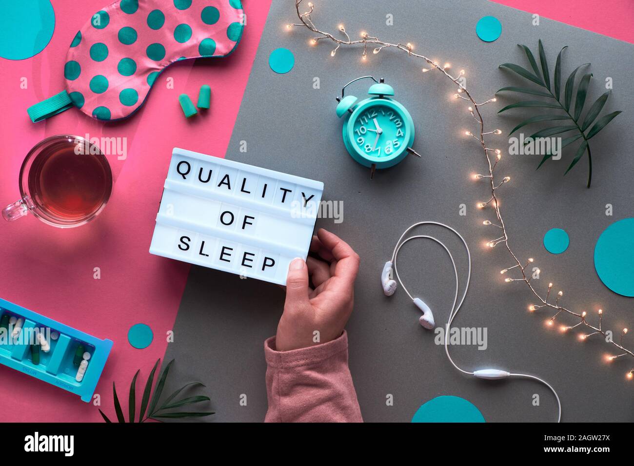 Healthy sleep concept, top view. Sleeping mask, cyan alarm clock ...