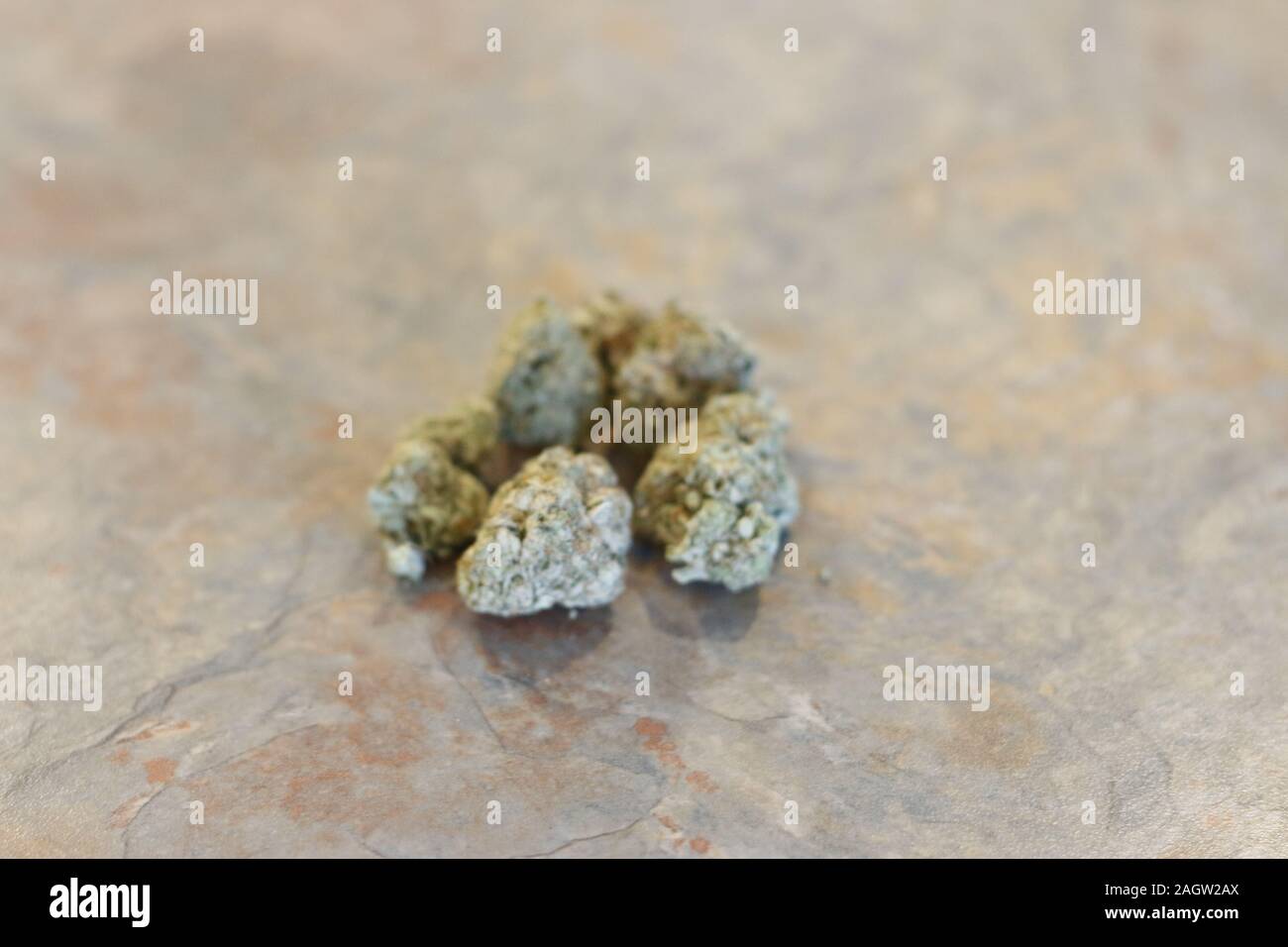 group of marijuana buds on a table top Stock Photo - Alamy