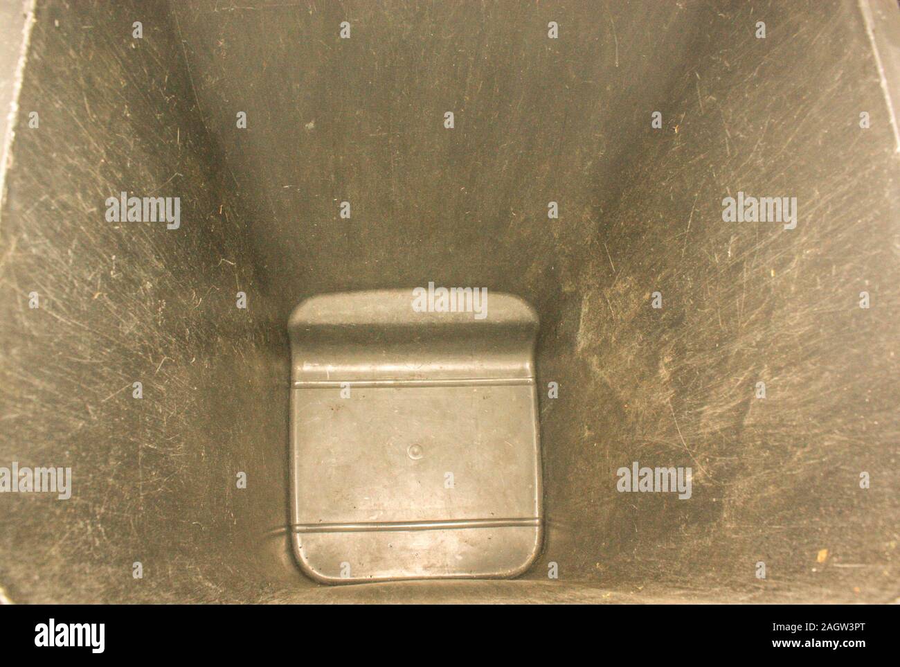 Looking down inside a clean / empty wheelie bin Stock Photo - Alamy