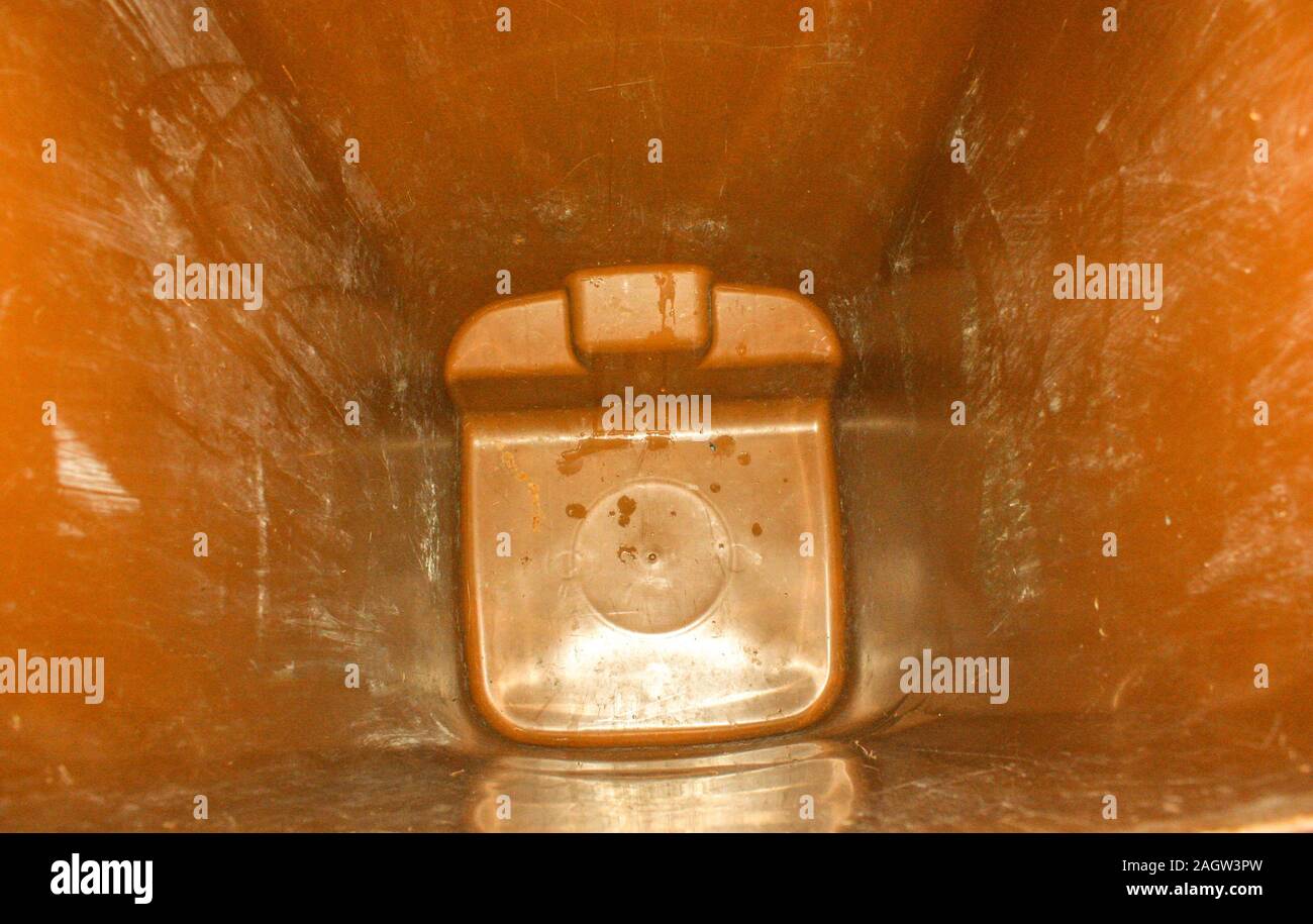 Looking down inside a clean / empty wheelie bin Stock Photo - Alamy