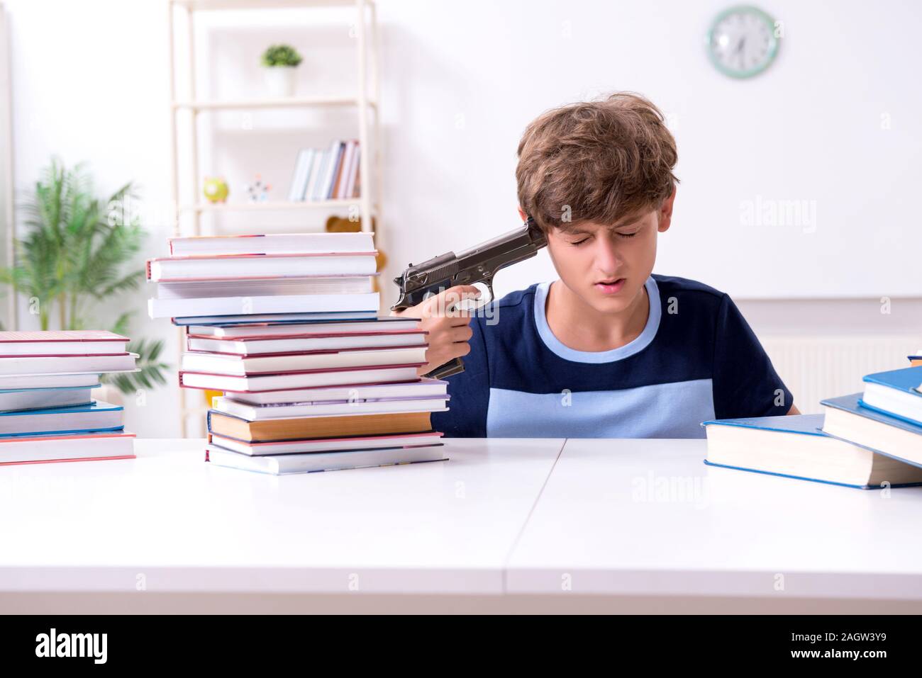 The young student stressed due to excessive studies Stock Photo - Alamy