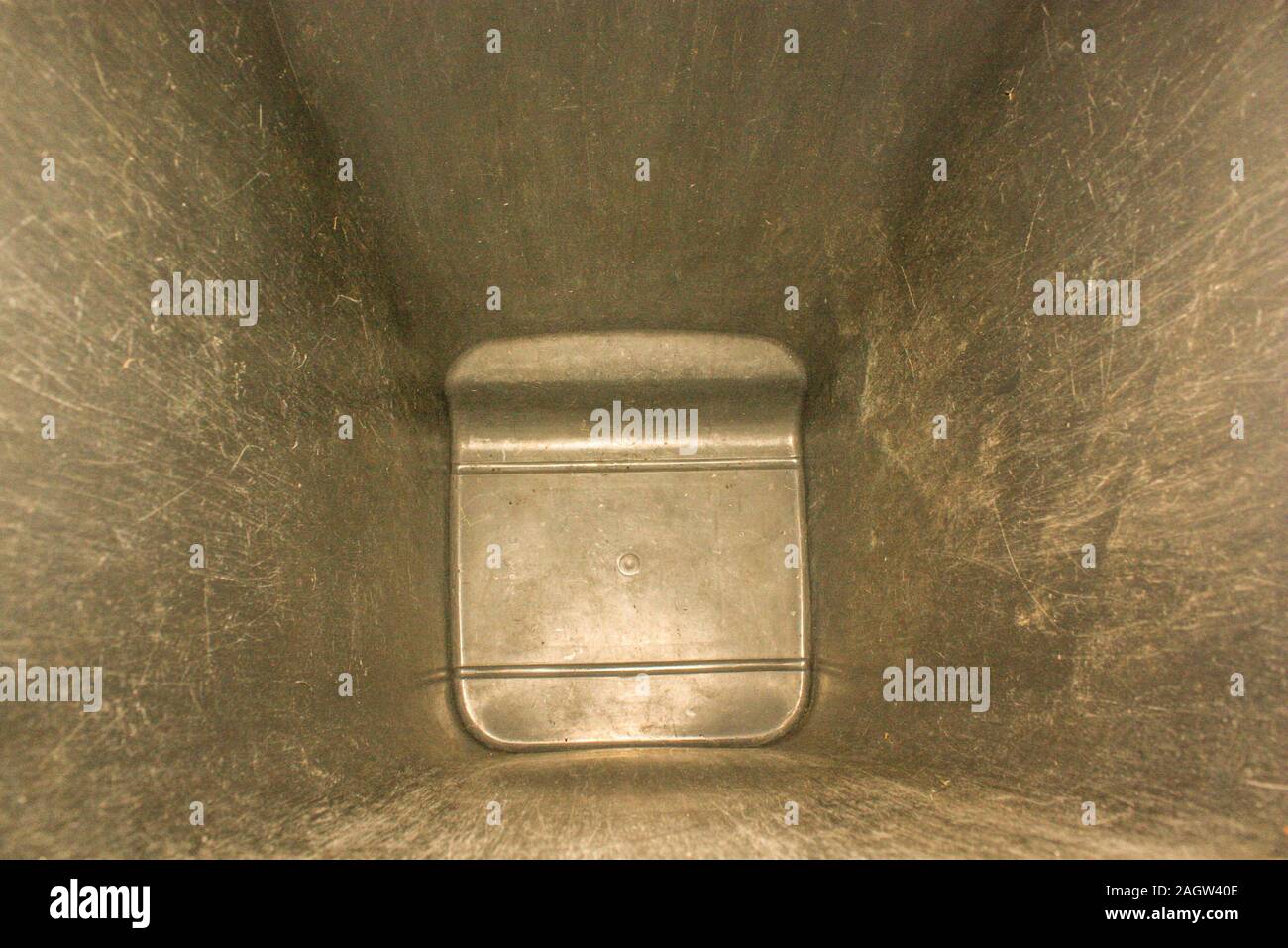 Looking down inside a clean / empty wheelie bin Stock Photo - Alamy