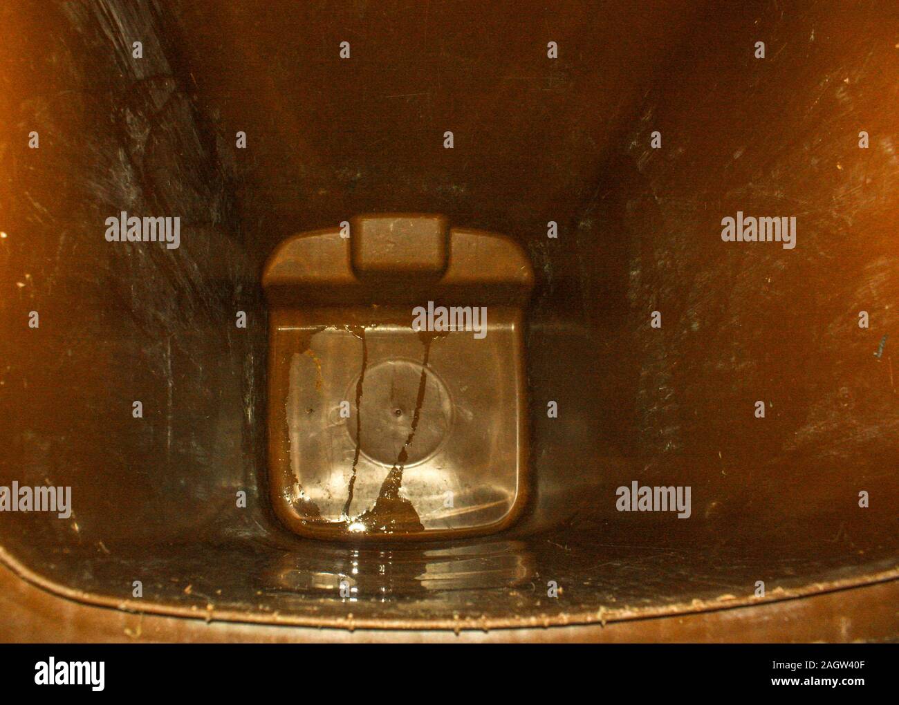 Looking down inside a clean / empty wheelie bin Stock Photo - Alamy