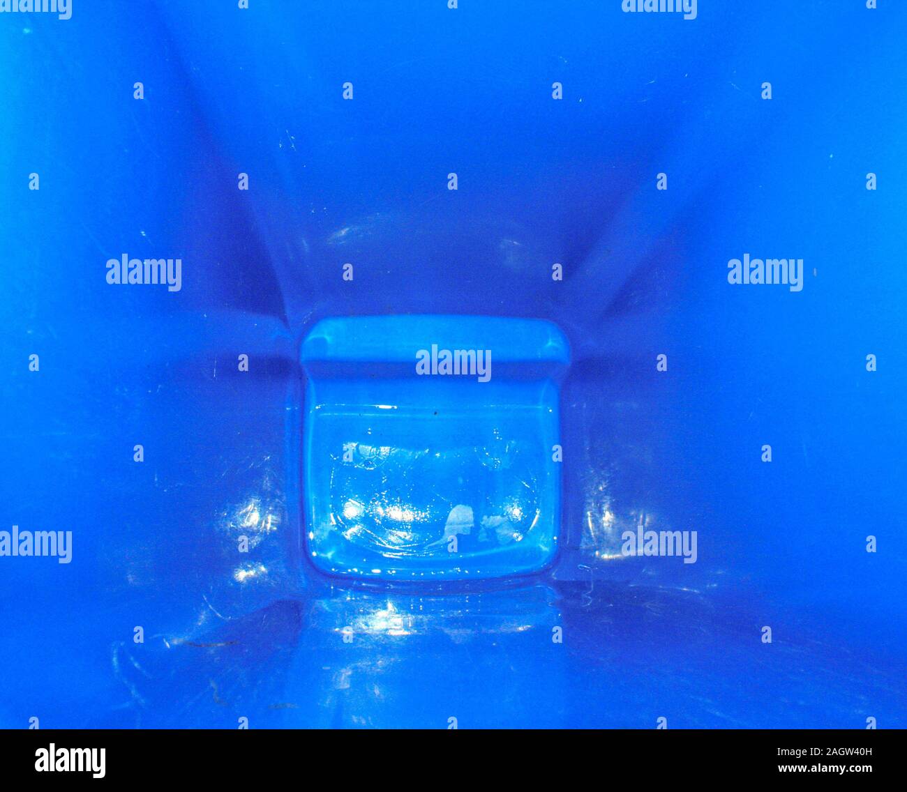 Looking down inside a clean / empty wheelie bin Stock Photo - Alamy