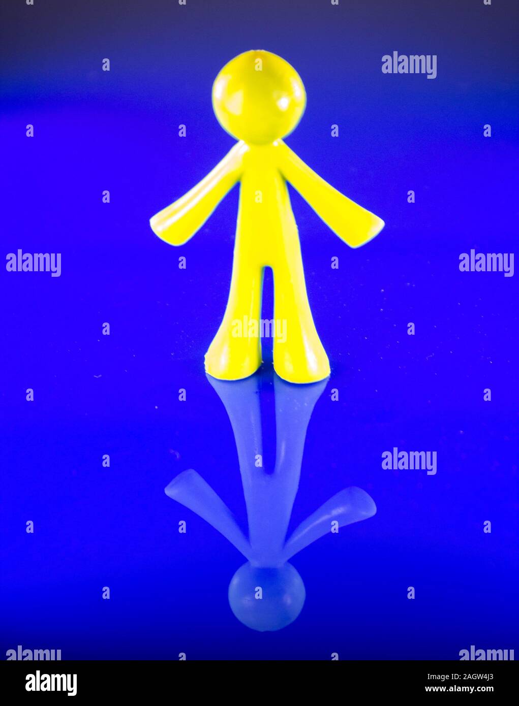 A plastic figure of a man standing tall Stock Photo - Alamy