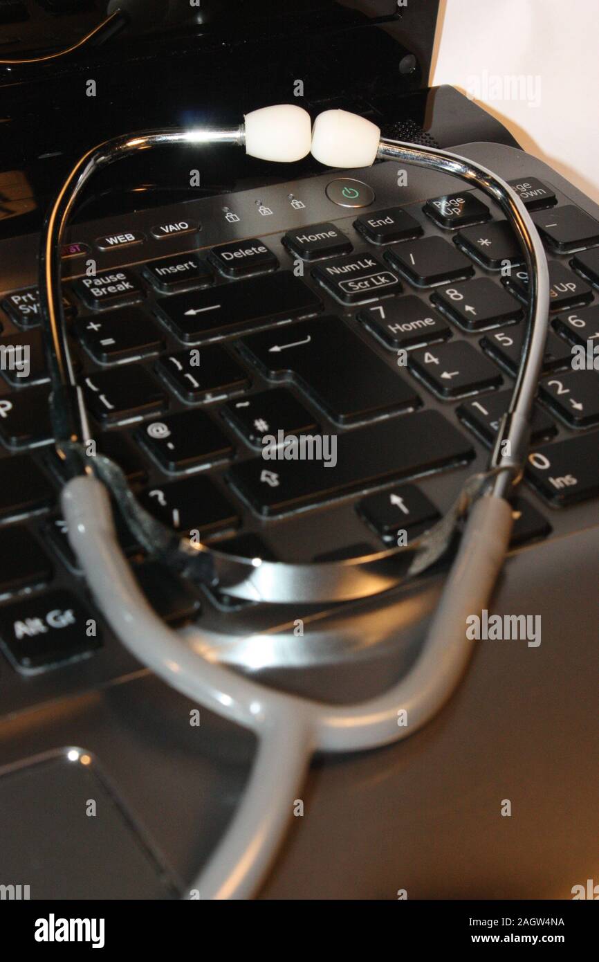 A doctor's laptop computer with a stethoscope on top Stock Photo - Alamy