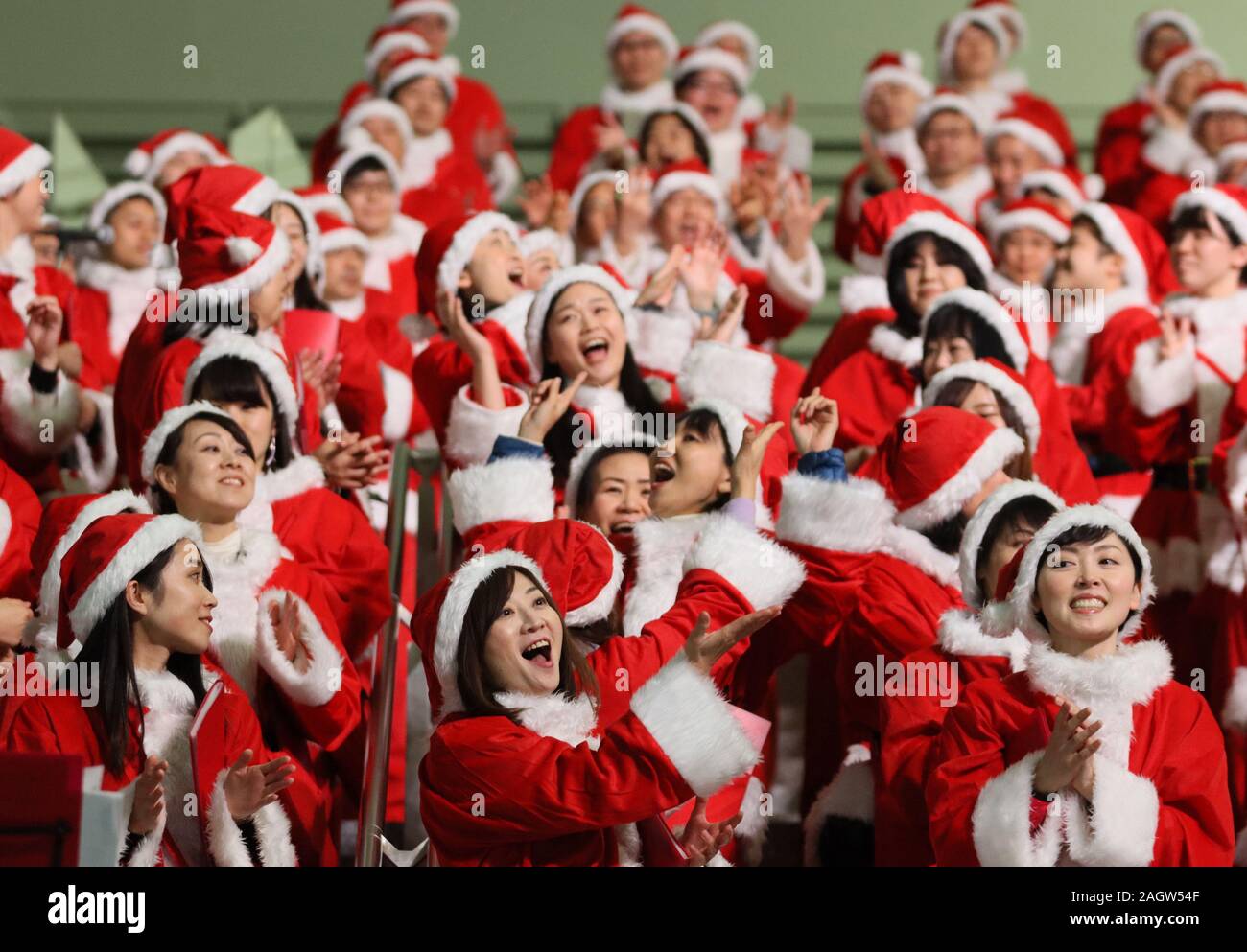 Tokyo, Japan. 20th Dec, 2019. 105 Santa Claus costumed singers working ...