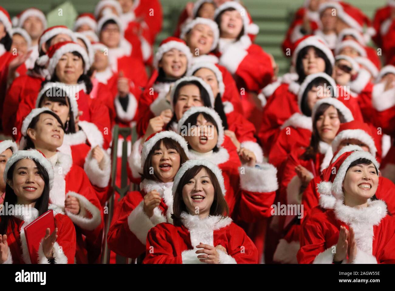Tokyo, Japan. 20th Dec, 2019. 105 Santa Claus costumed singers working ...