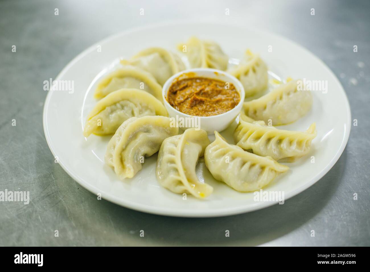 Nepalese traditional dumpling momos, Tibetan momo on the plate Stock ...