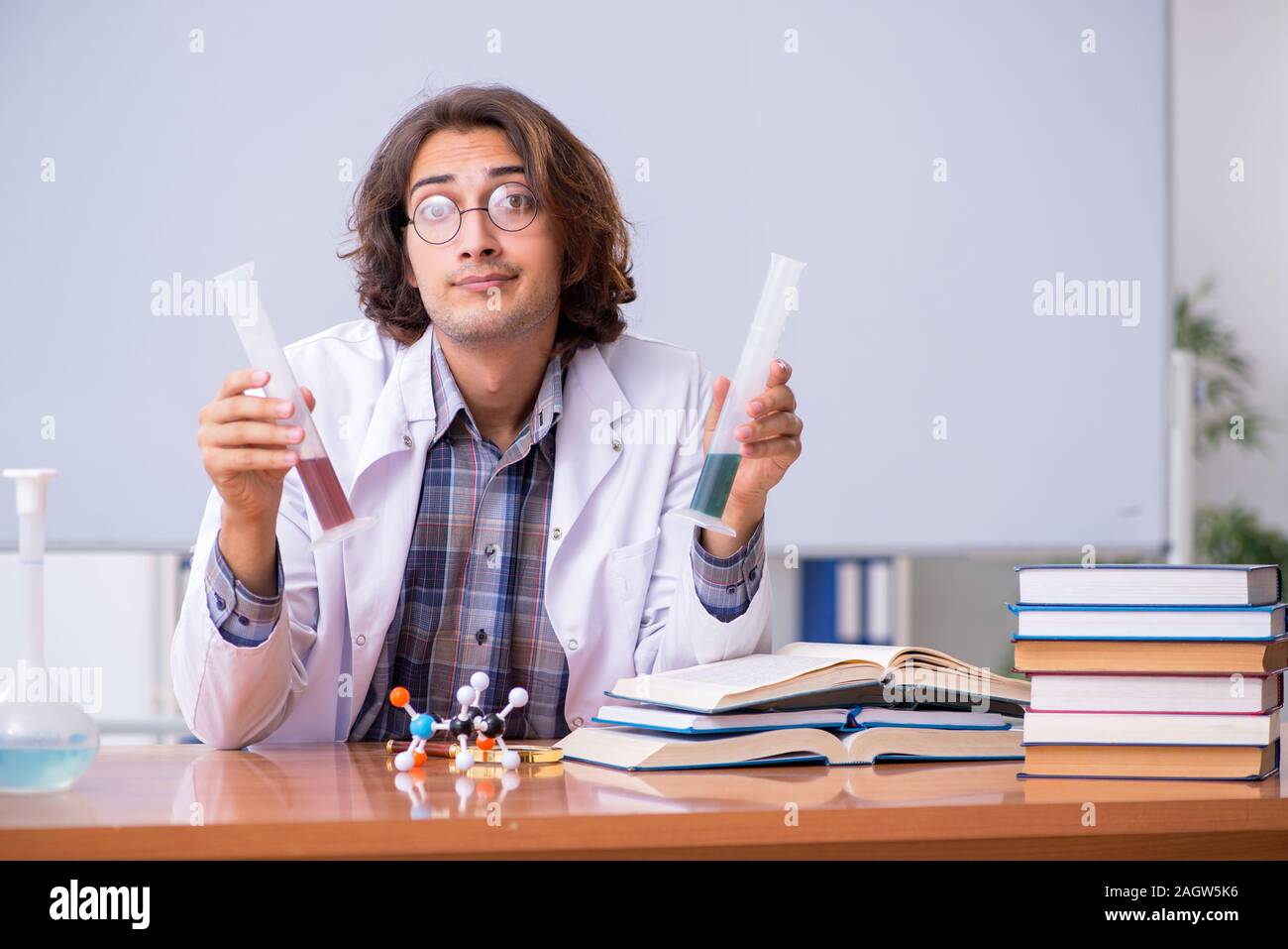The chemistry lecturer during lecture in college Stock Photo - Alamy