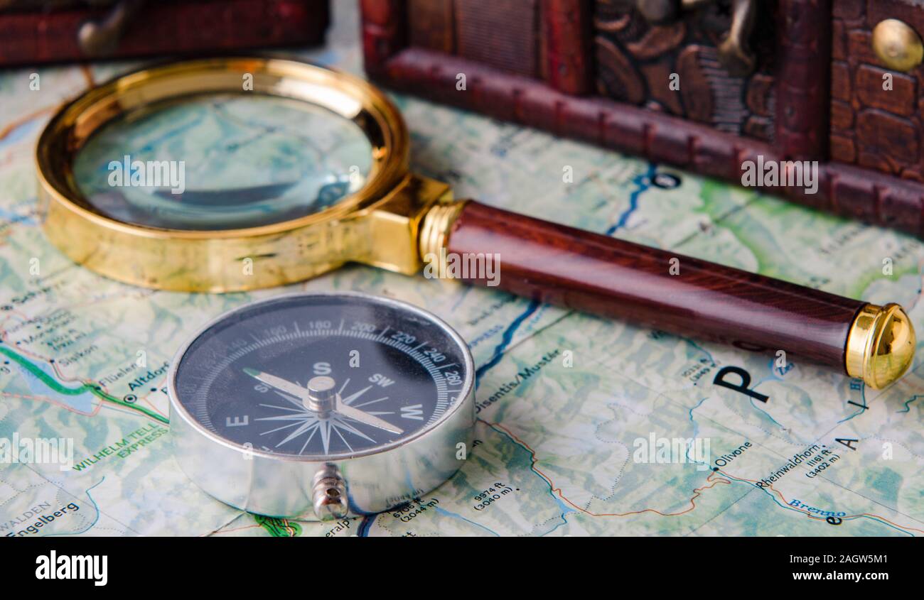 The travel concept with compass and map Stock Photo - Alamy