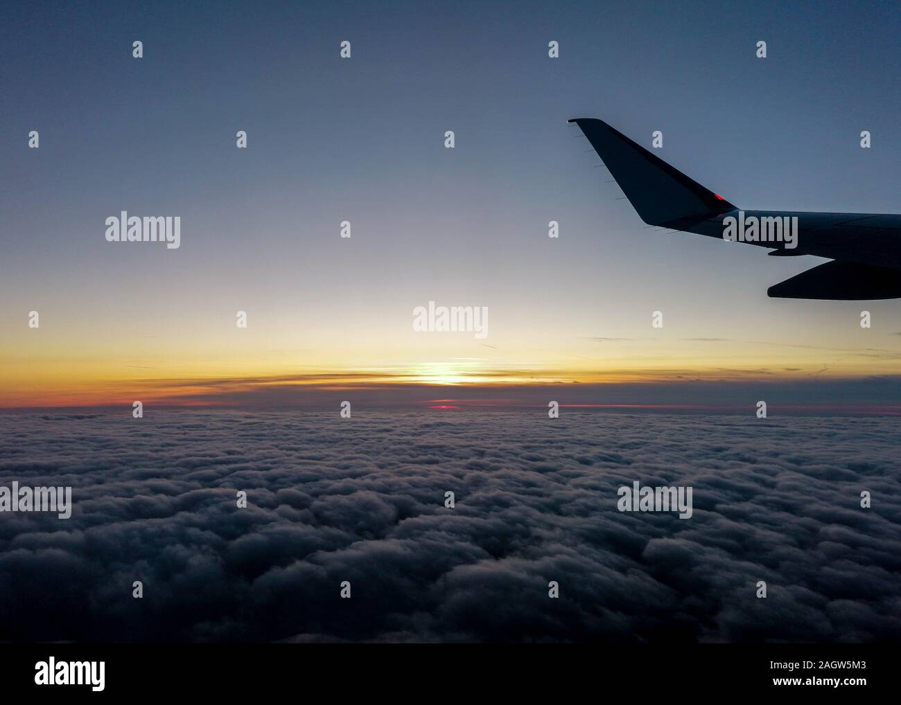 A passenger airline view across the awesome blue skies, during Autumn ...