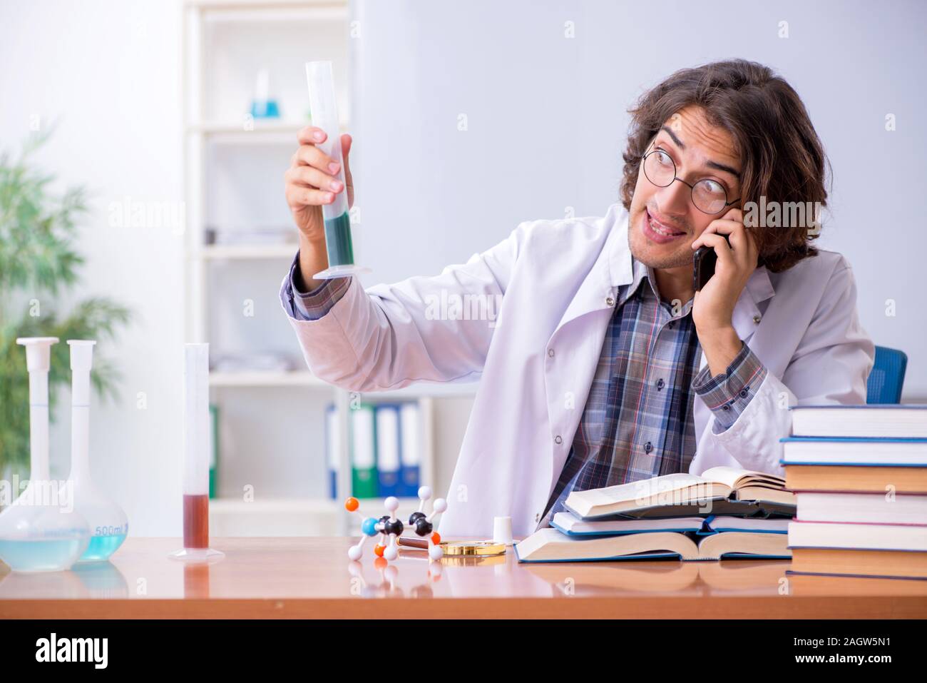 The chemistry lecturer during lecture in college Stock Photo - Alamy