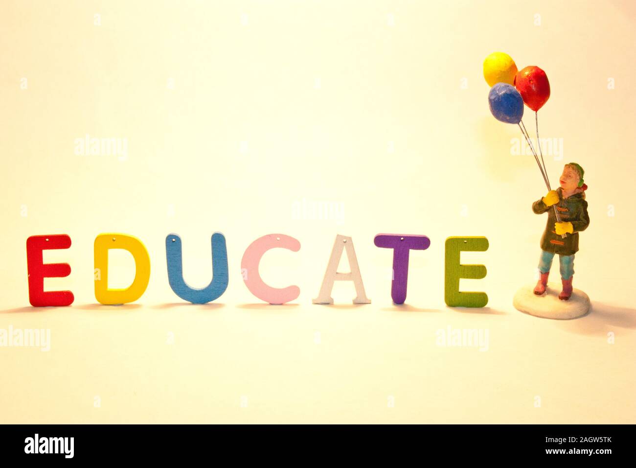 The word 'Educate' being made up from wooden coloured letters Stock ...
