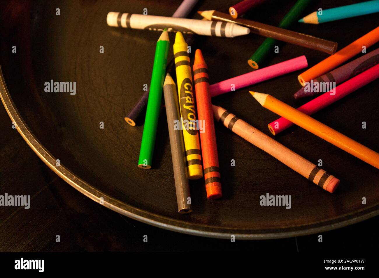 A selection of artist crayons and pencils, frying in a pan Stock Photo ...