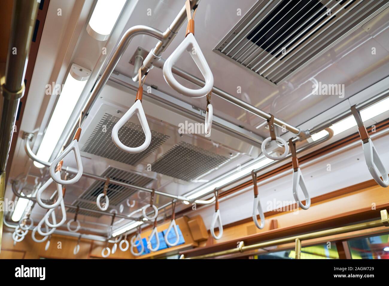 hand straps in empty tokyo train for safety when transportation Stock ...