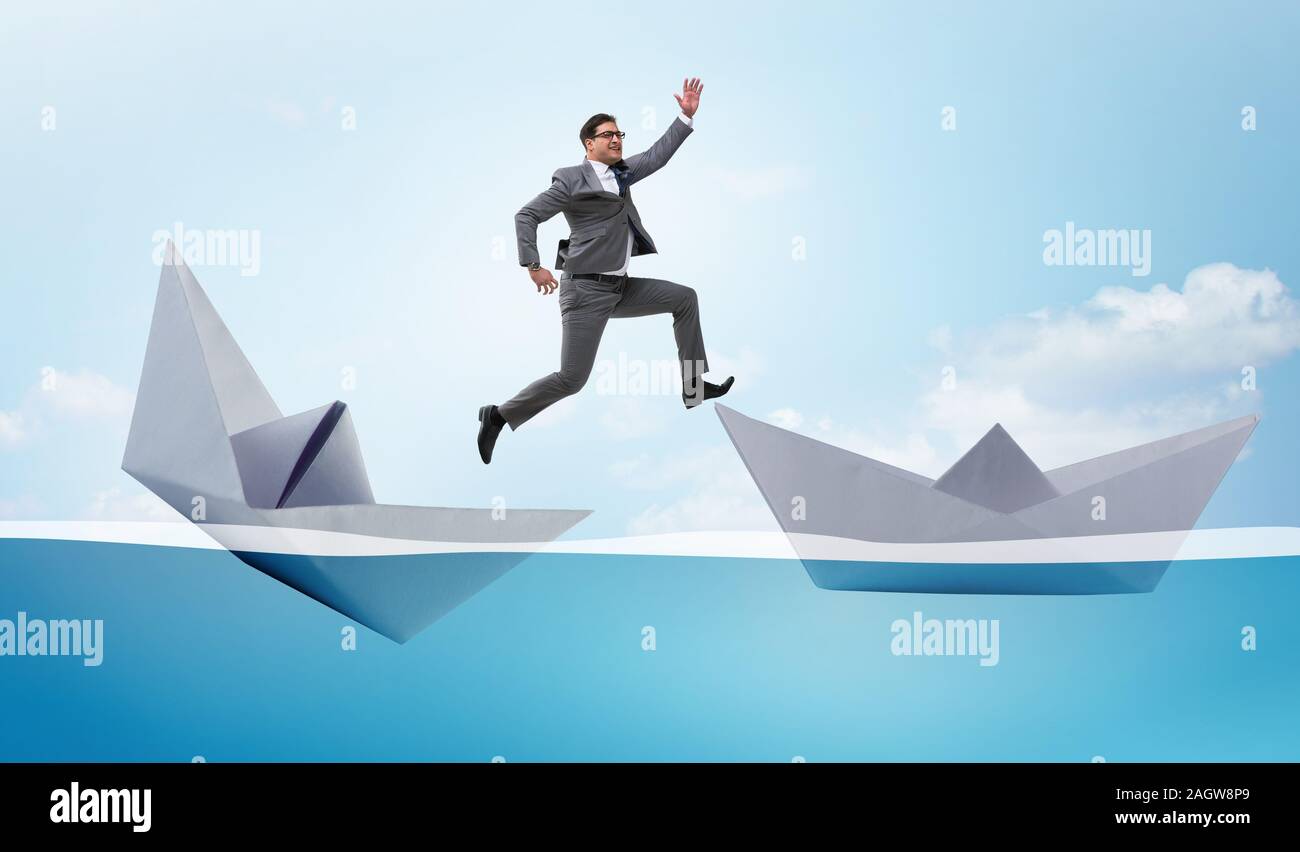 The businessman escaping sunken paper boat ship Stock Photo - Alamy