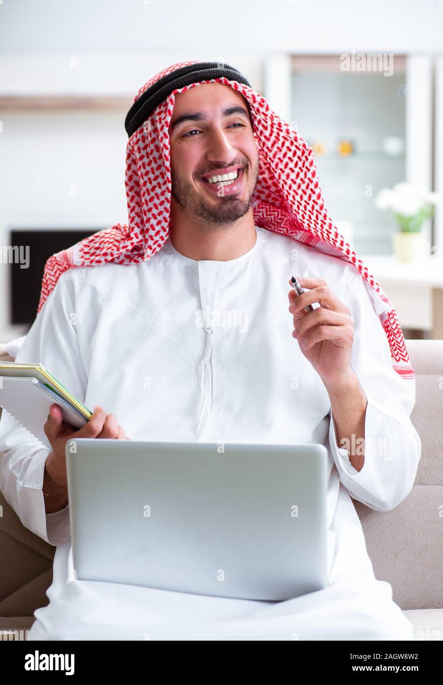 The arab man working at home on his work Stock Photo - Alamy