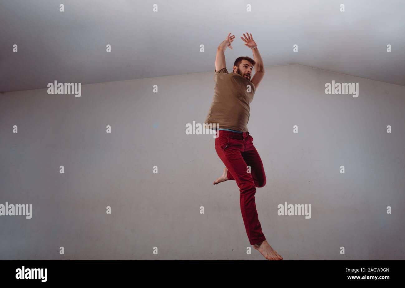 Young dance performer practicing a contemporary dance movement Stock ...
