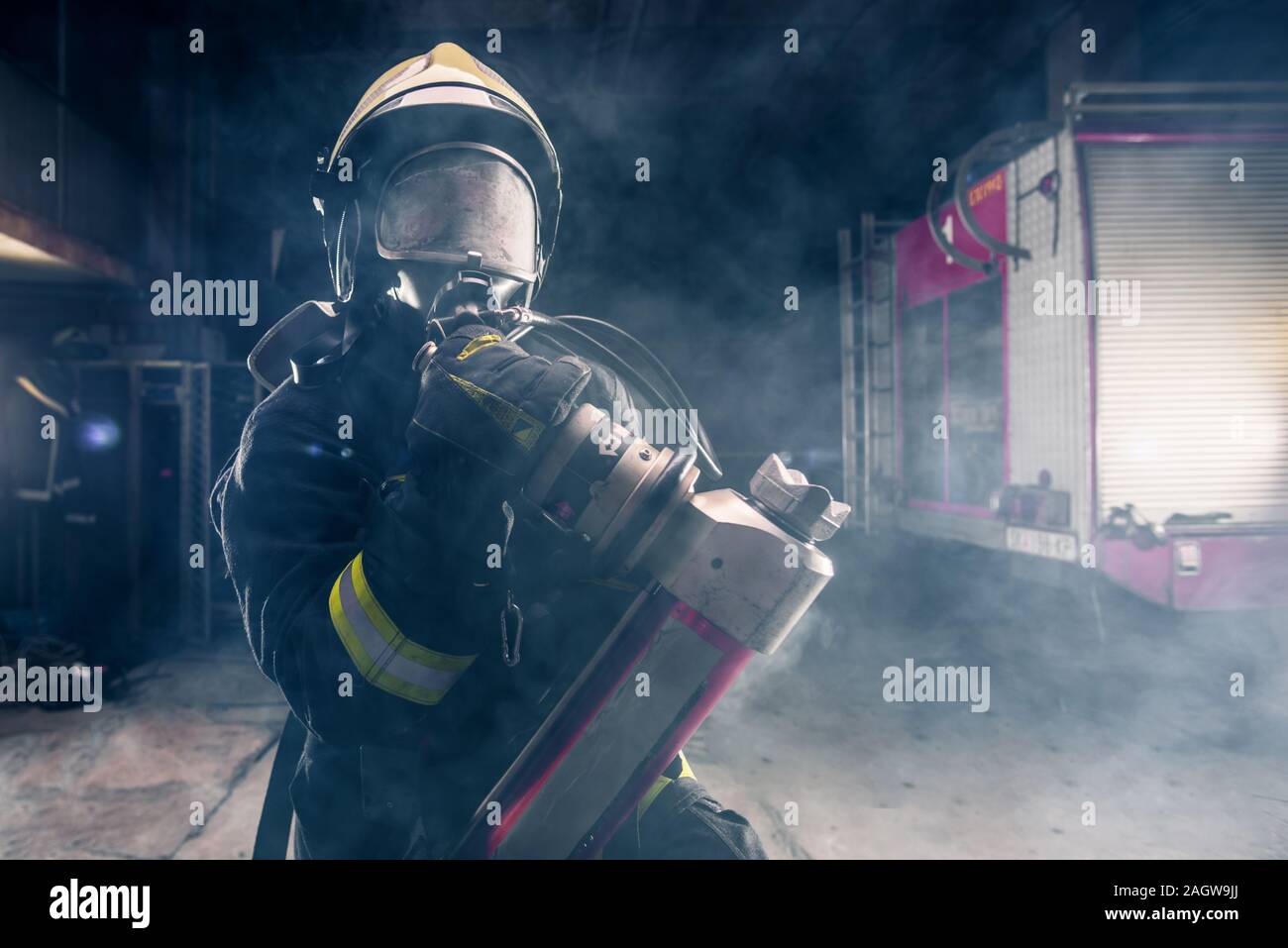 Portrait of a female firefighter wearing a helmet and all safety ...