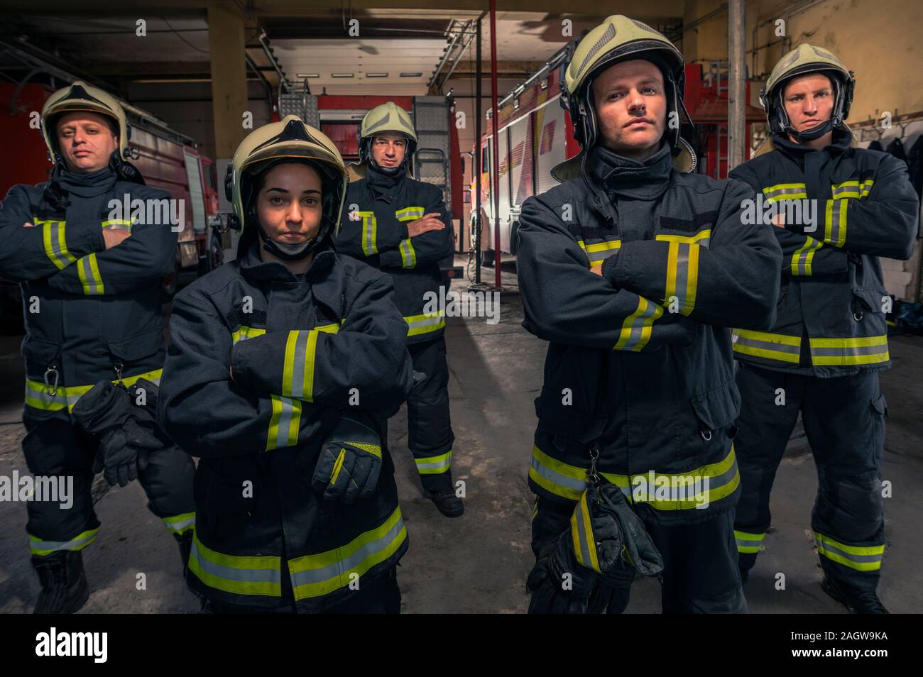 Group of firefighters standing confident with arms crossed. Firemen ...