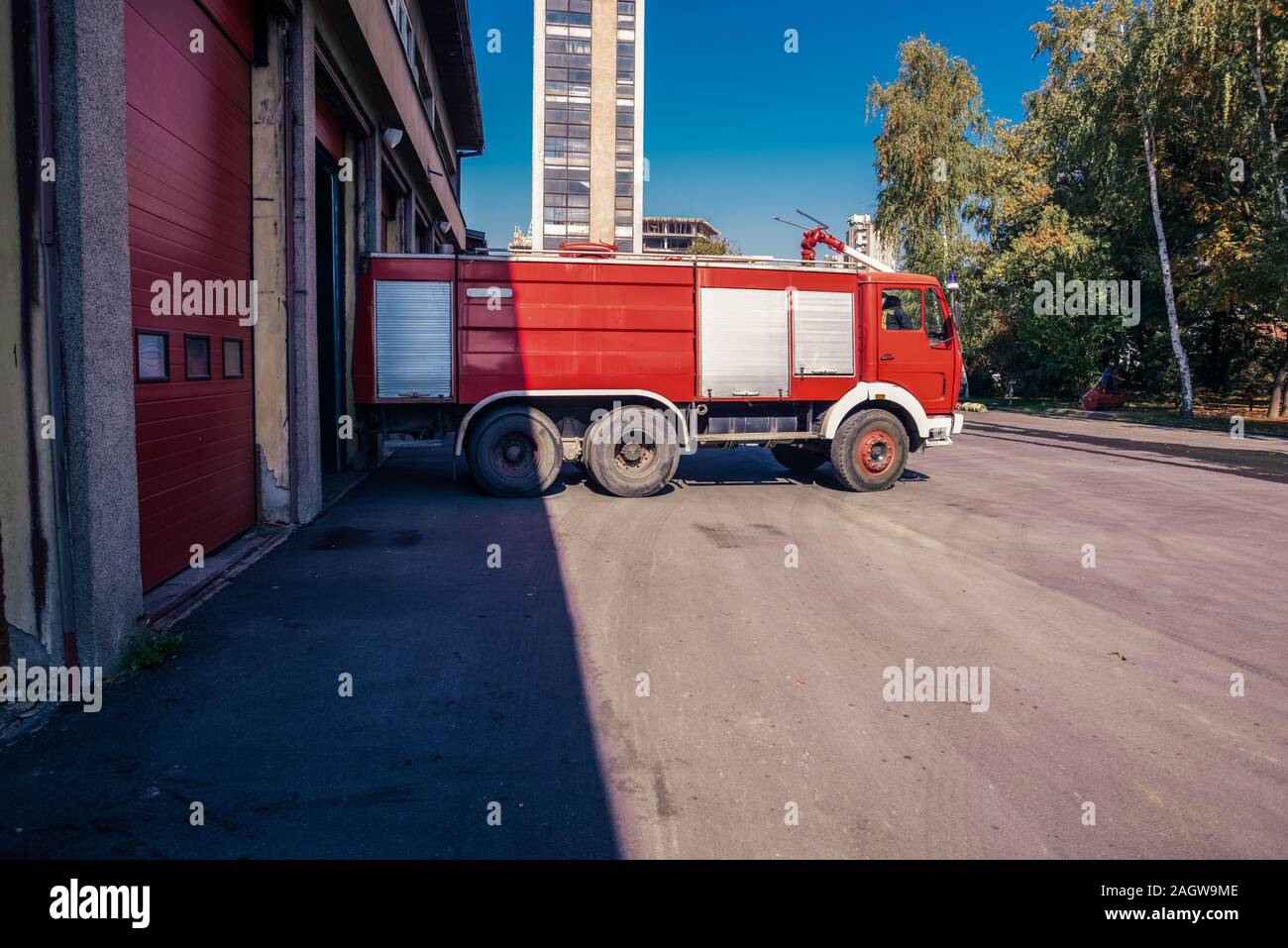 Fire truck leaving fire station hi-res stock photography and images - Alamy