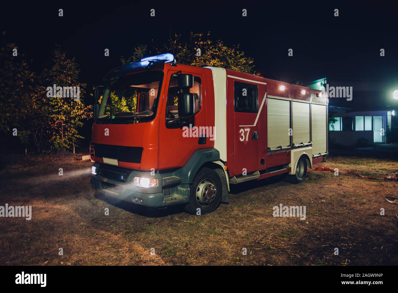 Firefighting vehicle responding to fire emergency situation Stock Photo ...