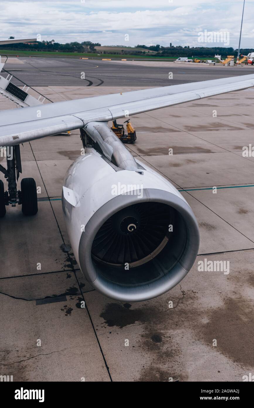 Airliner powered by jet engines with boarding steps for travellers ...