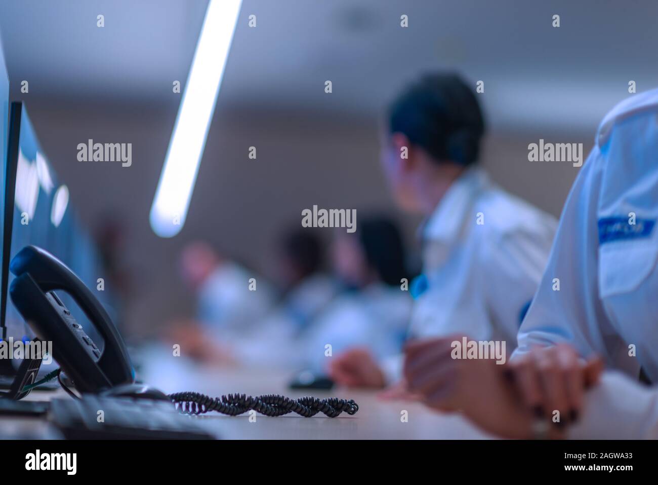 Close up photo of office phone and security data operator in a ...