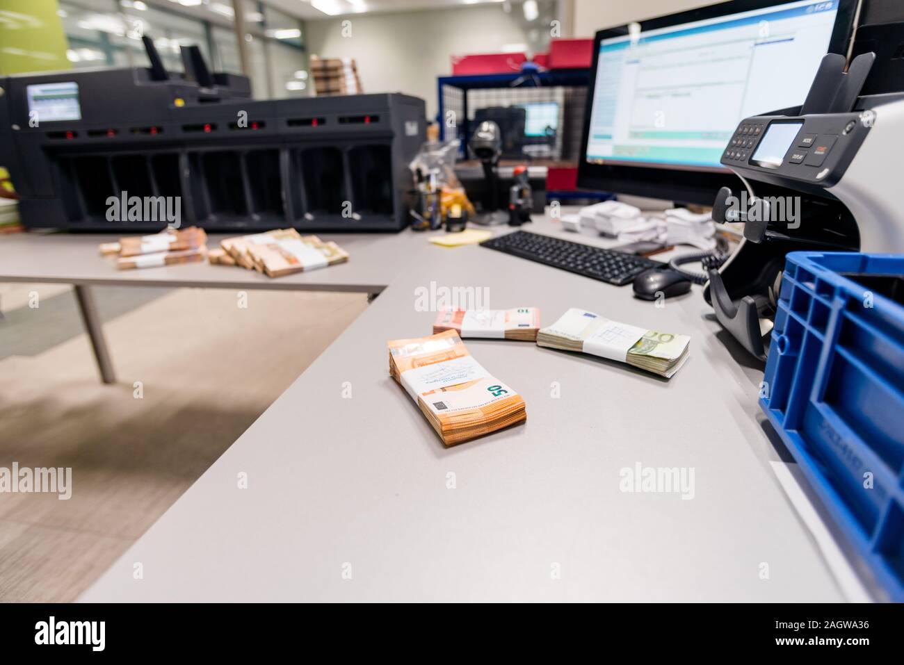 Euro € money divided with currency straps placed in front of a ...