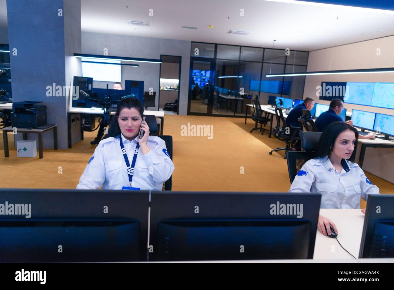 Technical Operator Works at His Workstation with Multiple Displays ...