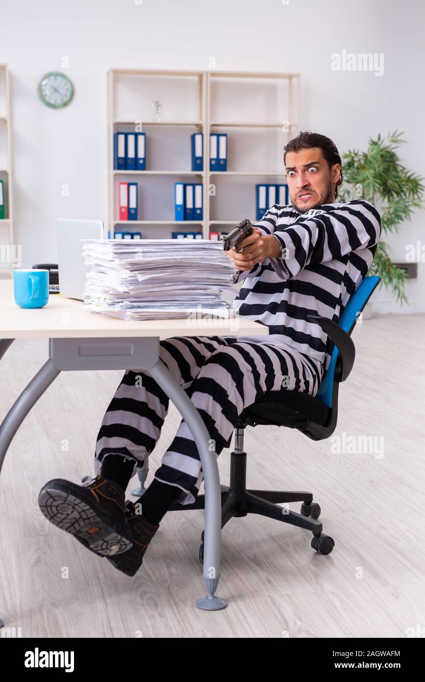 The young employee feeling like prisoner at work Stock Photo - Alamy