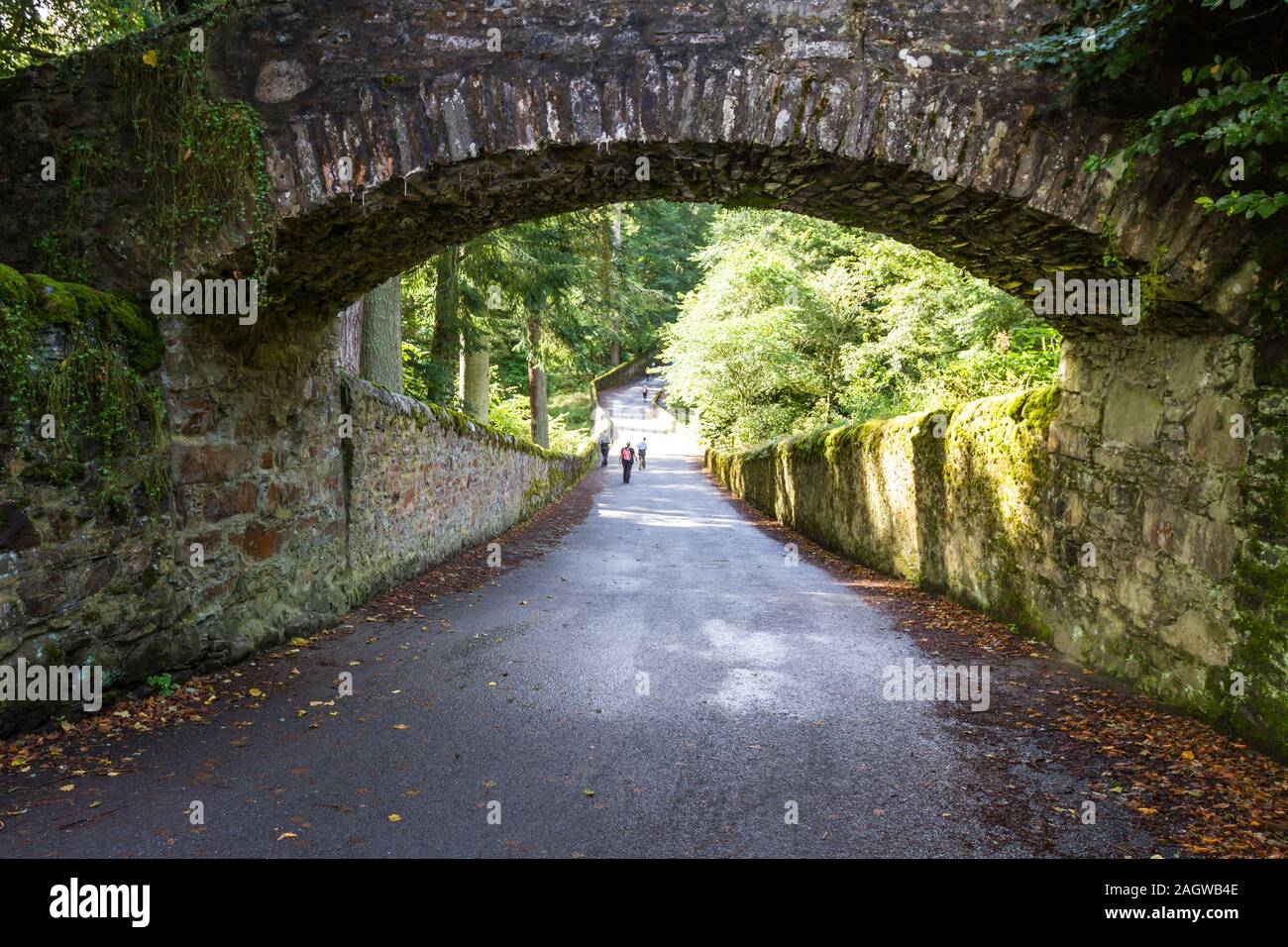 Moss covered stone walls and an arch entering the Blair Castle grounds ...