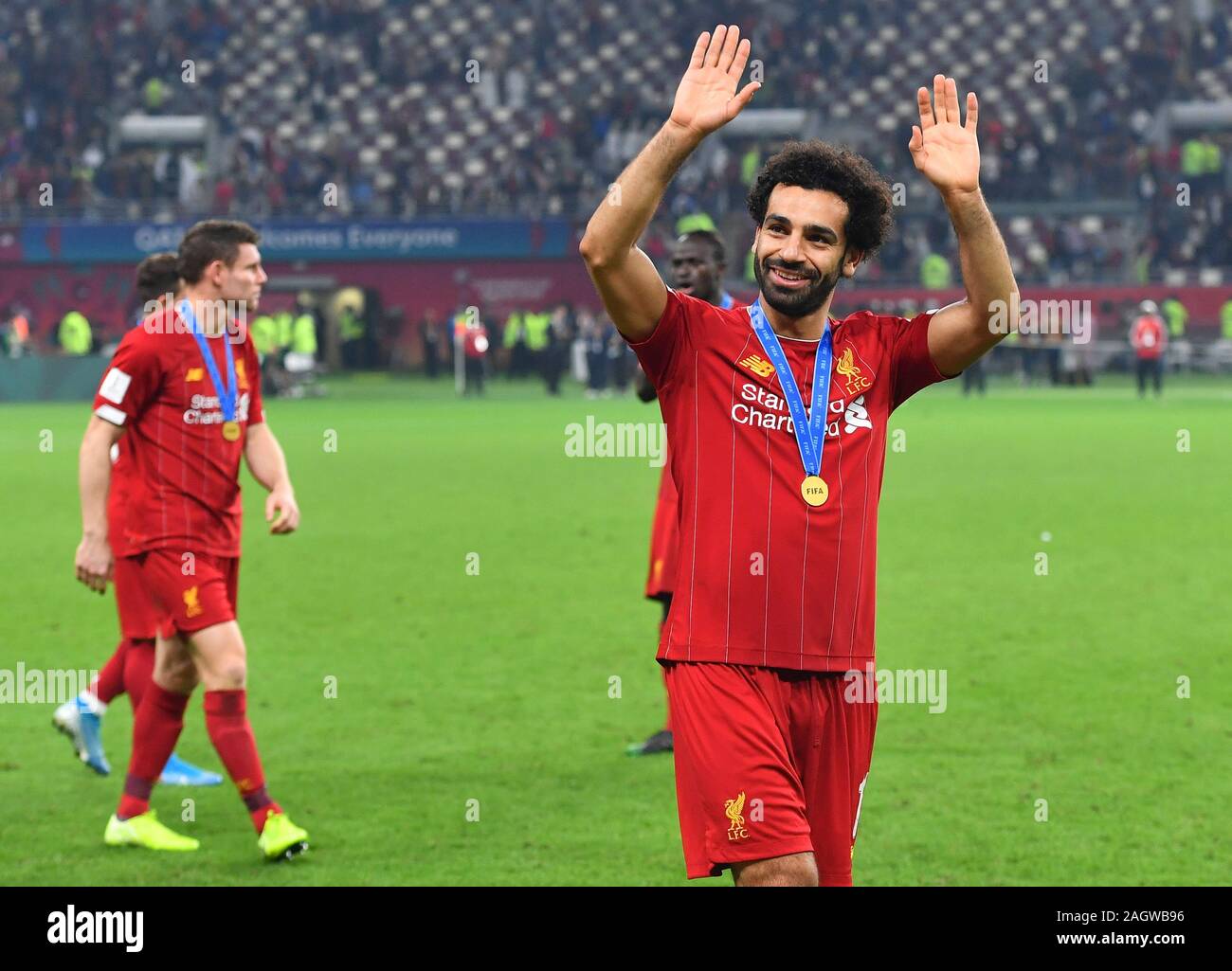 Doha, Qatar. 21st Dec, 2019. Mohamed Salah (R) of Liverpool greets the ...